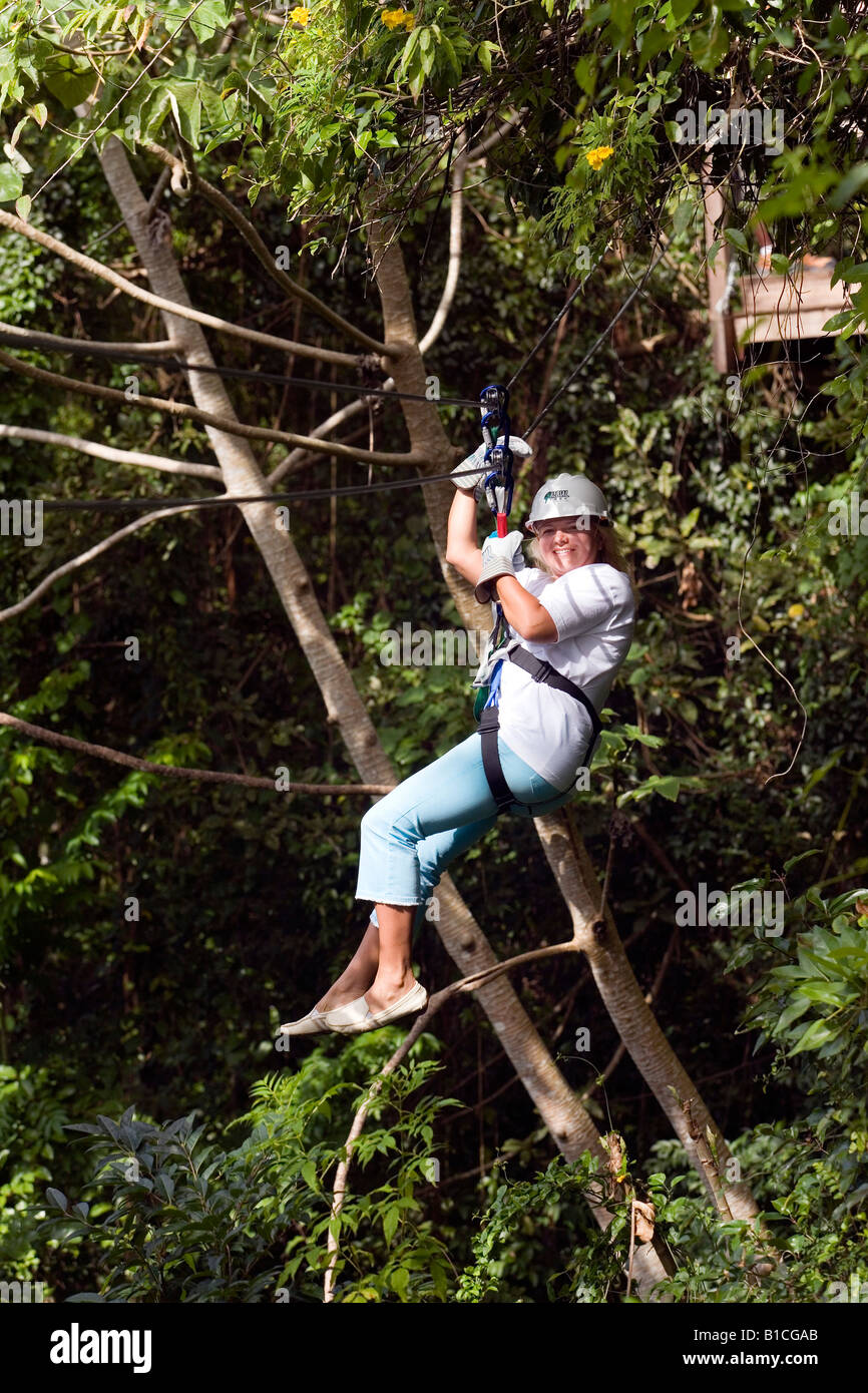Woman enjoying a zip slide aerial trek Barbados Caribbean Stock Photo ...