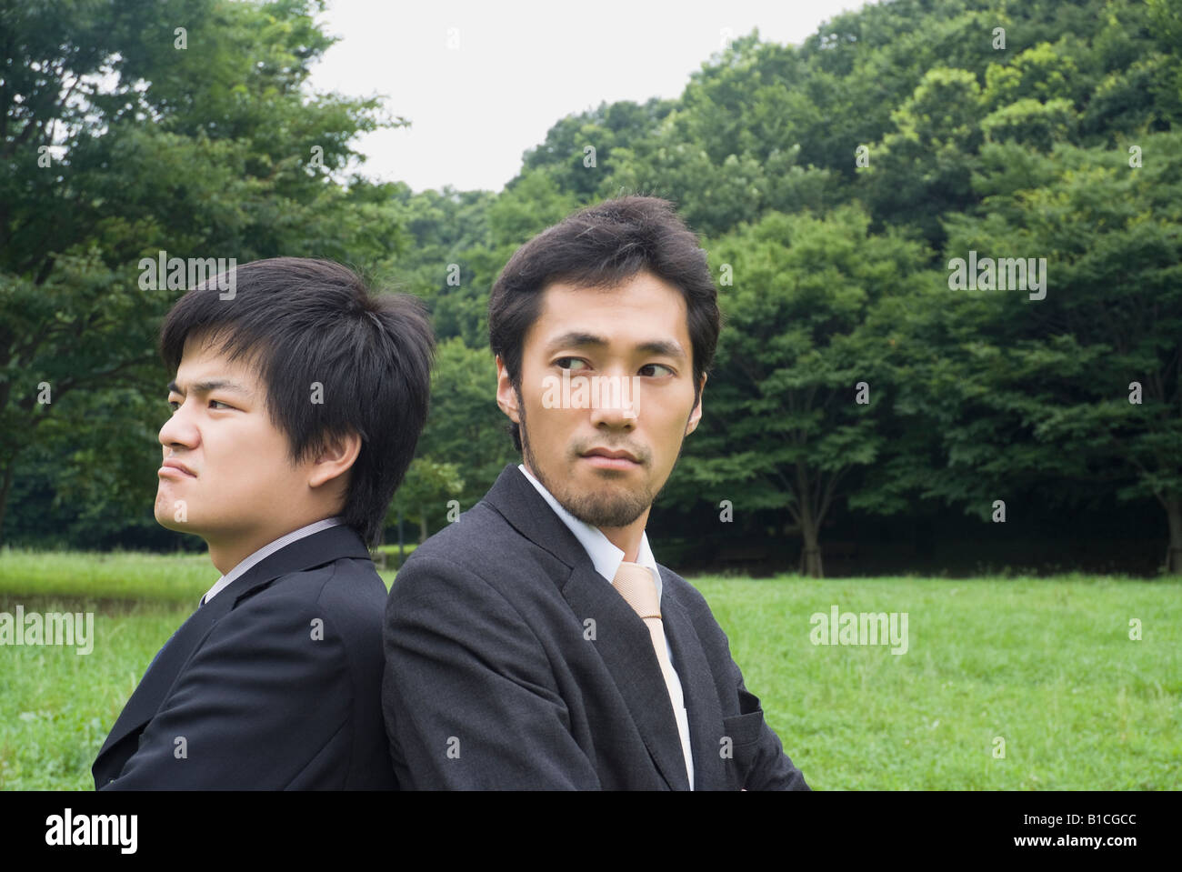 Portrait of two businessmen standing Stock Photo - Alamy