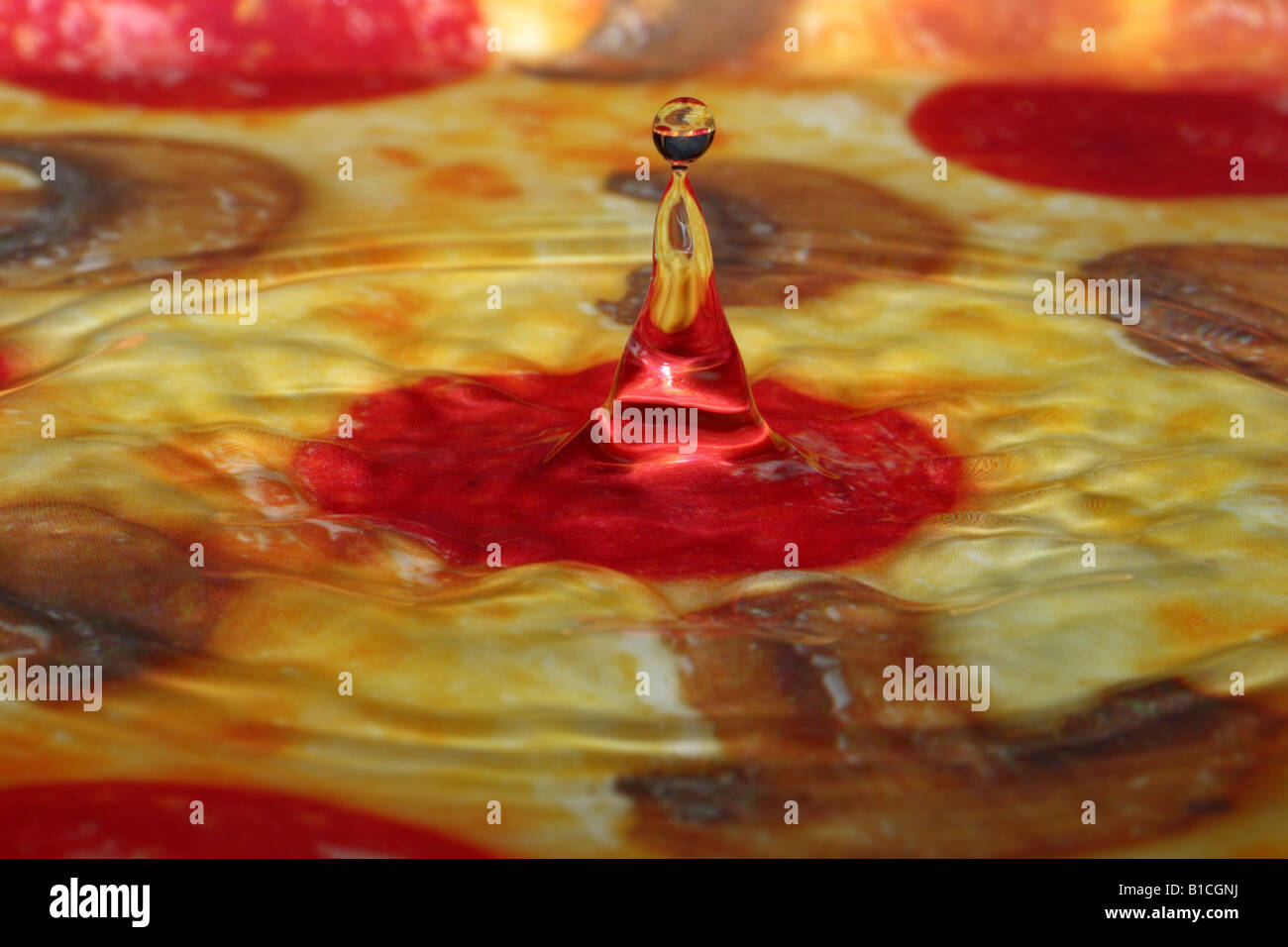 Water drop hitting surface of clear water Stock Photo - Alamy