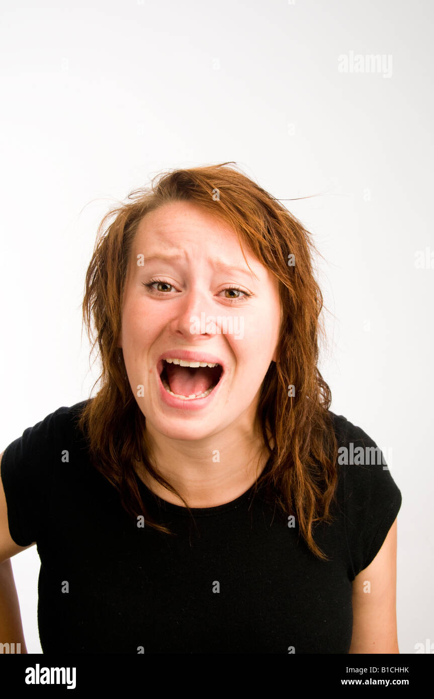 red haired angry furious woman girl shouting yelling and screaming ...