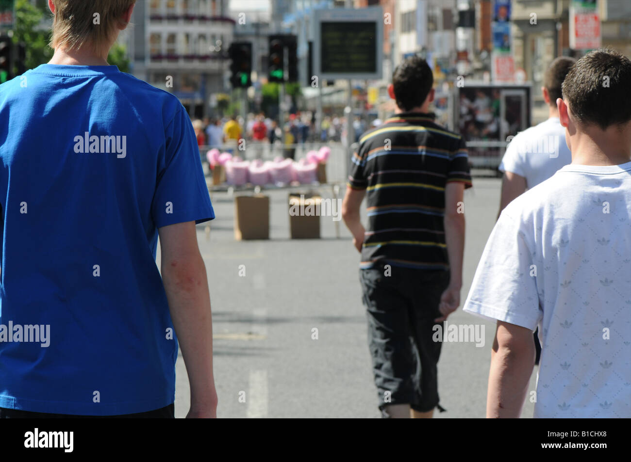 Men walking away in Stephens Green Dublin Stock Photo - Alamy