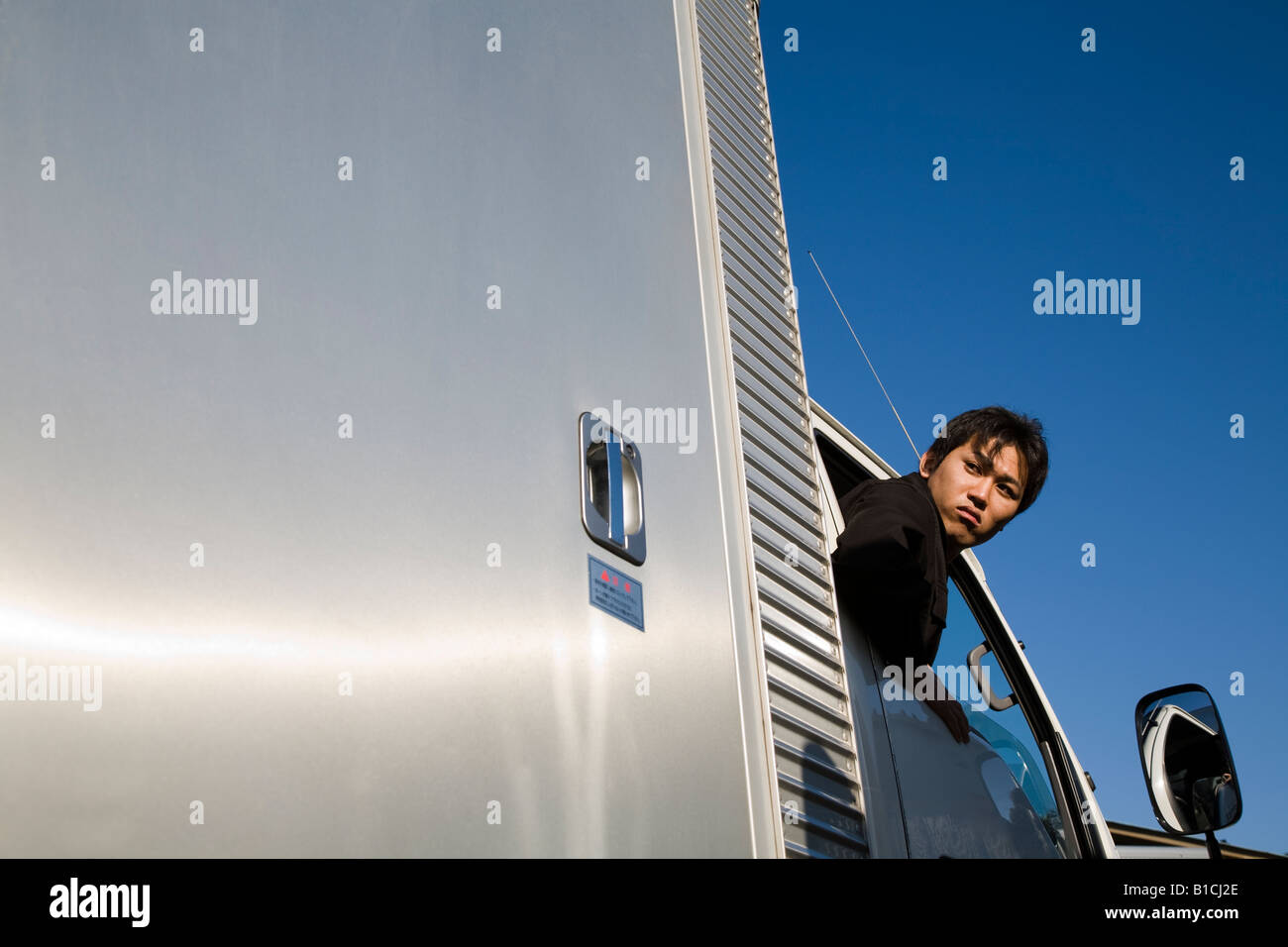 Driver driving truck backward Stock Photo - Alamy