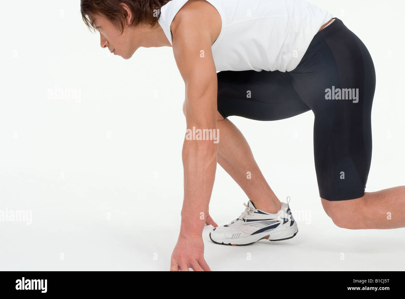 Young man ready to run Stock Photo - Alamy