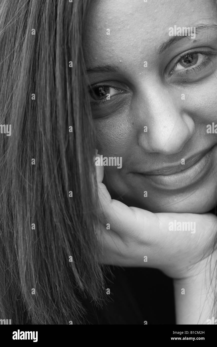 Young woman hand on chin Black and White Stock Photos & Images - Alamy