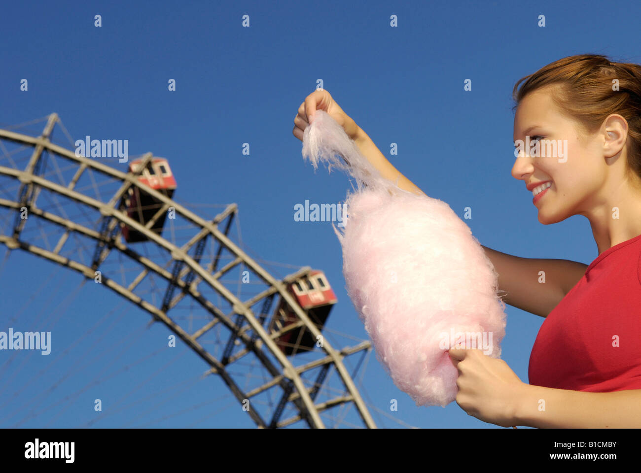 amusement park Prater Vienna, young woman with candy floss, Giant Ferry ...
