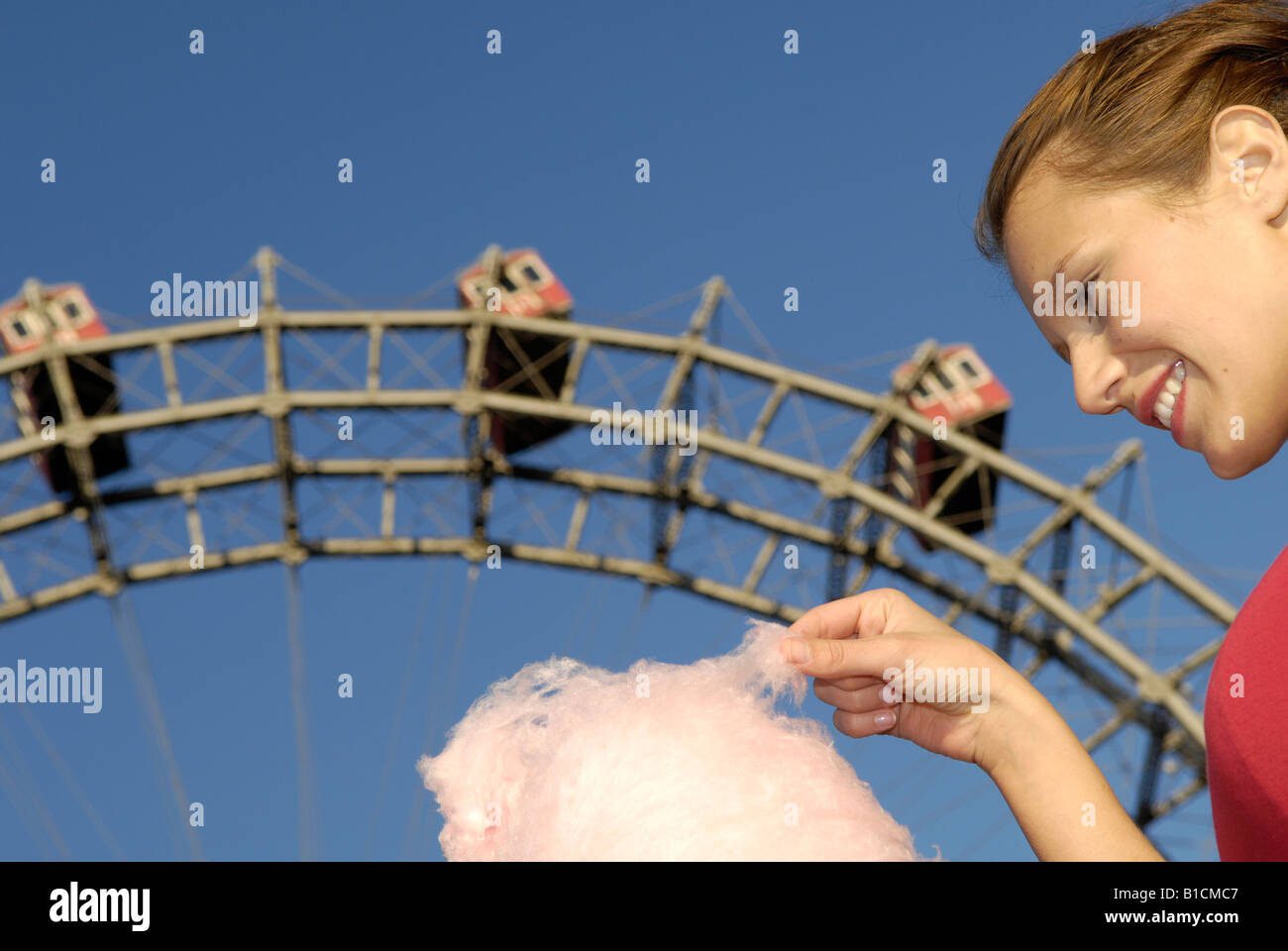 amusement park Prater Vienna, young woman with candy floss, Giant Ferry ...