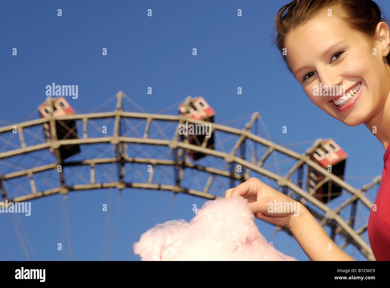 amusement park Prater Vienna, young woman with candy floss, Giant Ferry ...