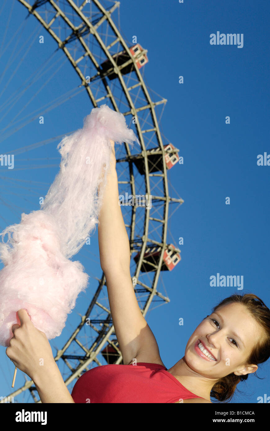 amusement park Prater Vienna, young woman with candy floss, Giant Ferry ...