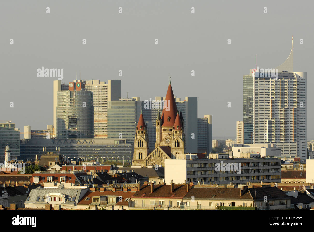 Donau City, Vienna DC. Historic church in front of modern high-rise ...