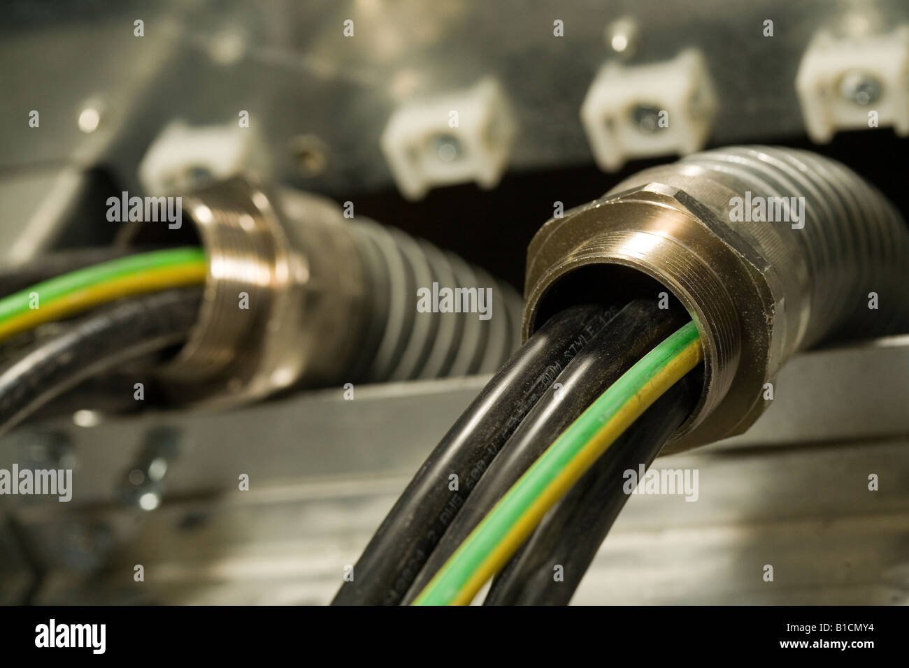 Power cables enter a juction box in a newly constructed London office ...