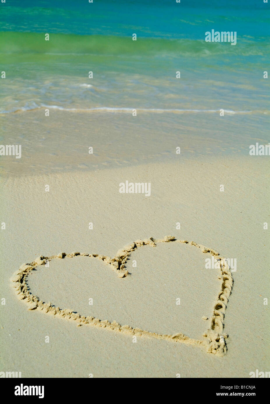 heart in sandy beach Stock Photo - Alamy