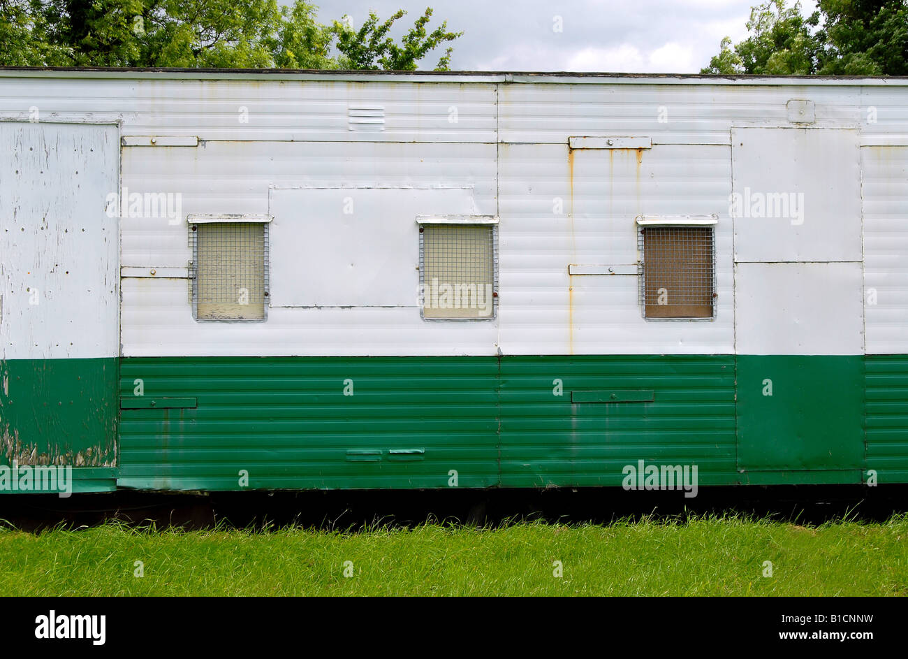 Green and white rusty caravan Stock Photo - Alamy