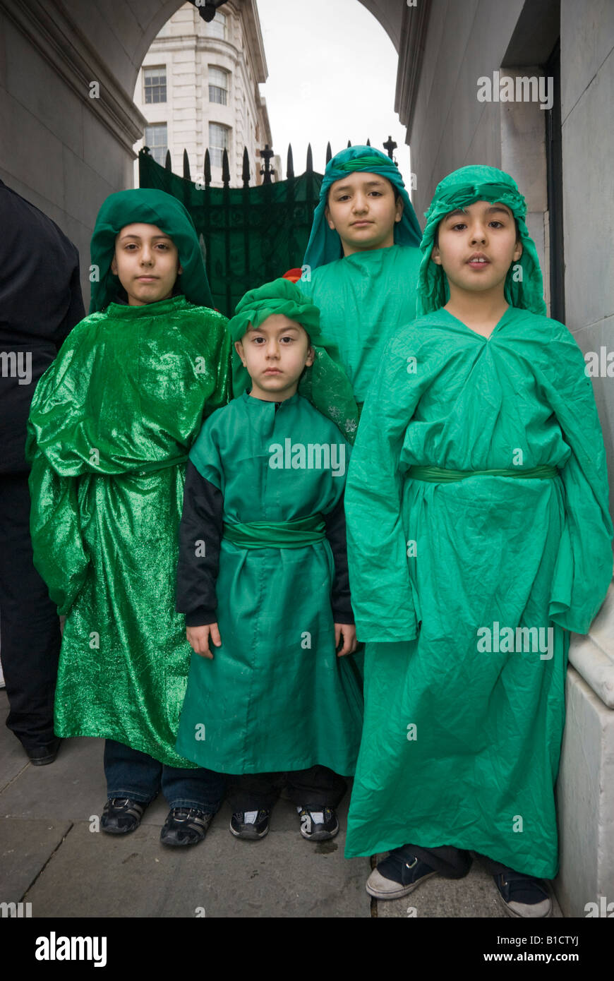 Four Shia Muslim children in green ready to re-enact the march of the ...