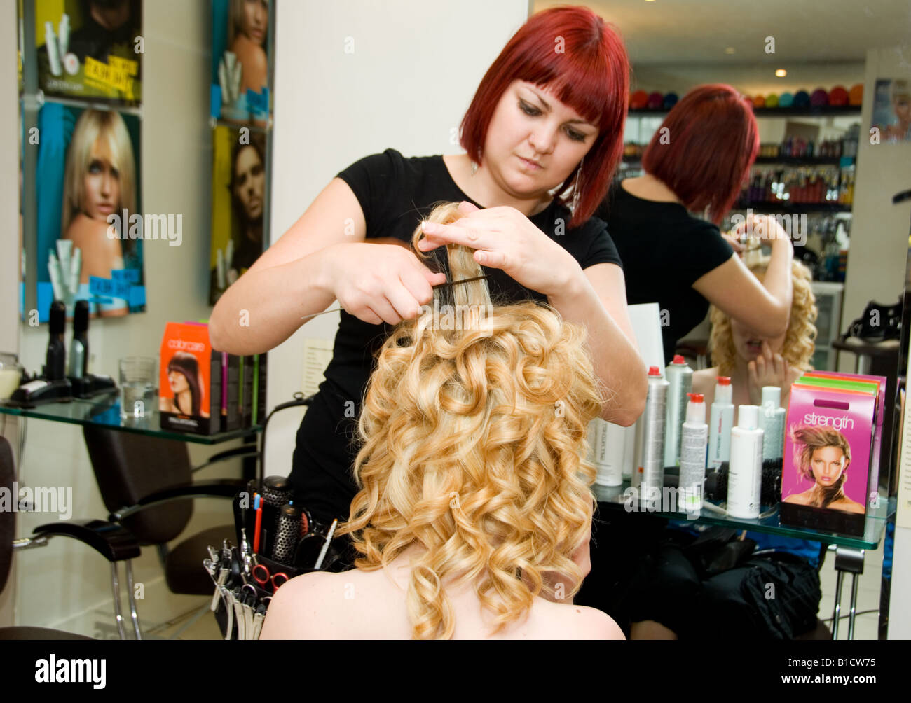 Hair stylist and client Stock Photo - Alamy