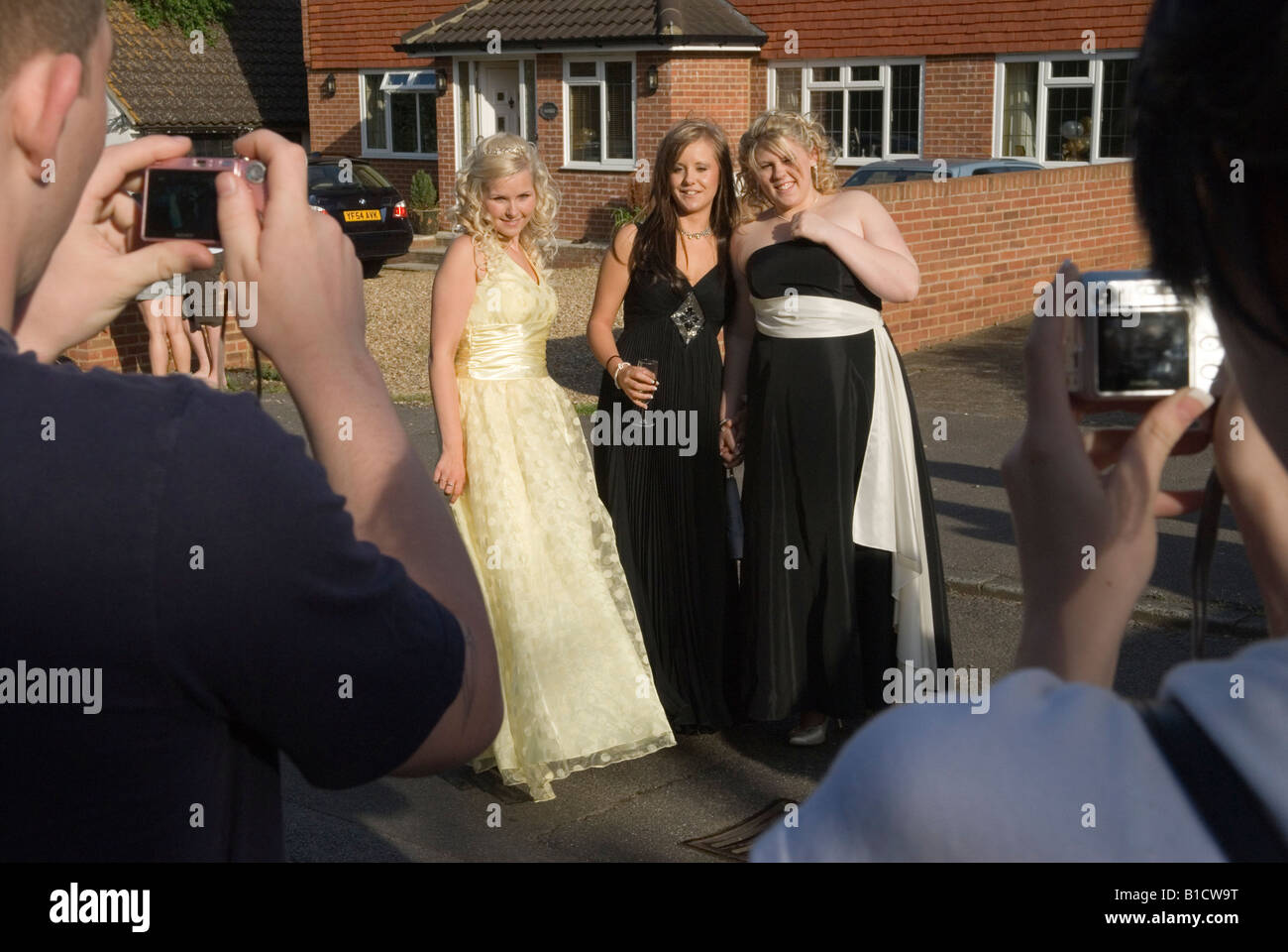 Prom school party teenage girls in their new long dresses, proud ...