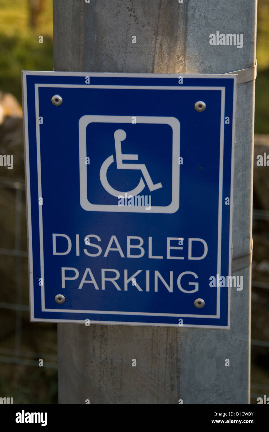 Disabled parking sign on signpost Stock Photo - Alamy