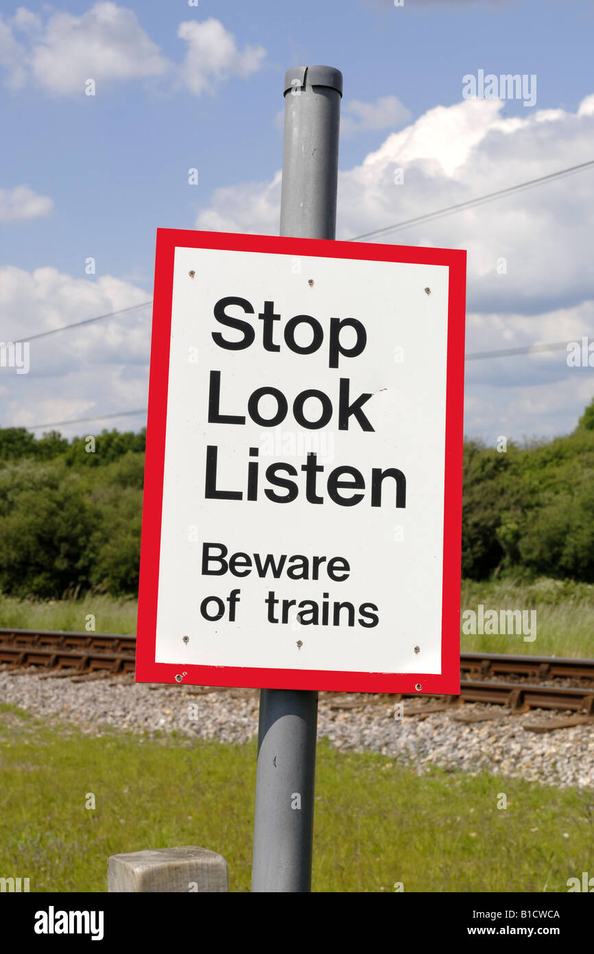 Stop Look Listen Beware of Trains signpost Stock Photo - Alamy