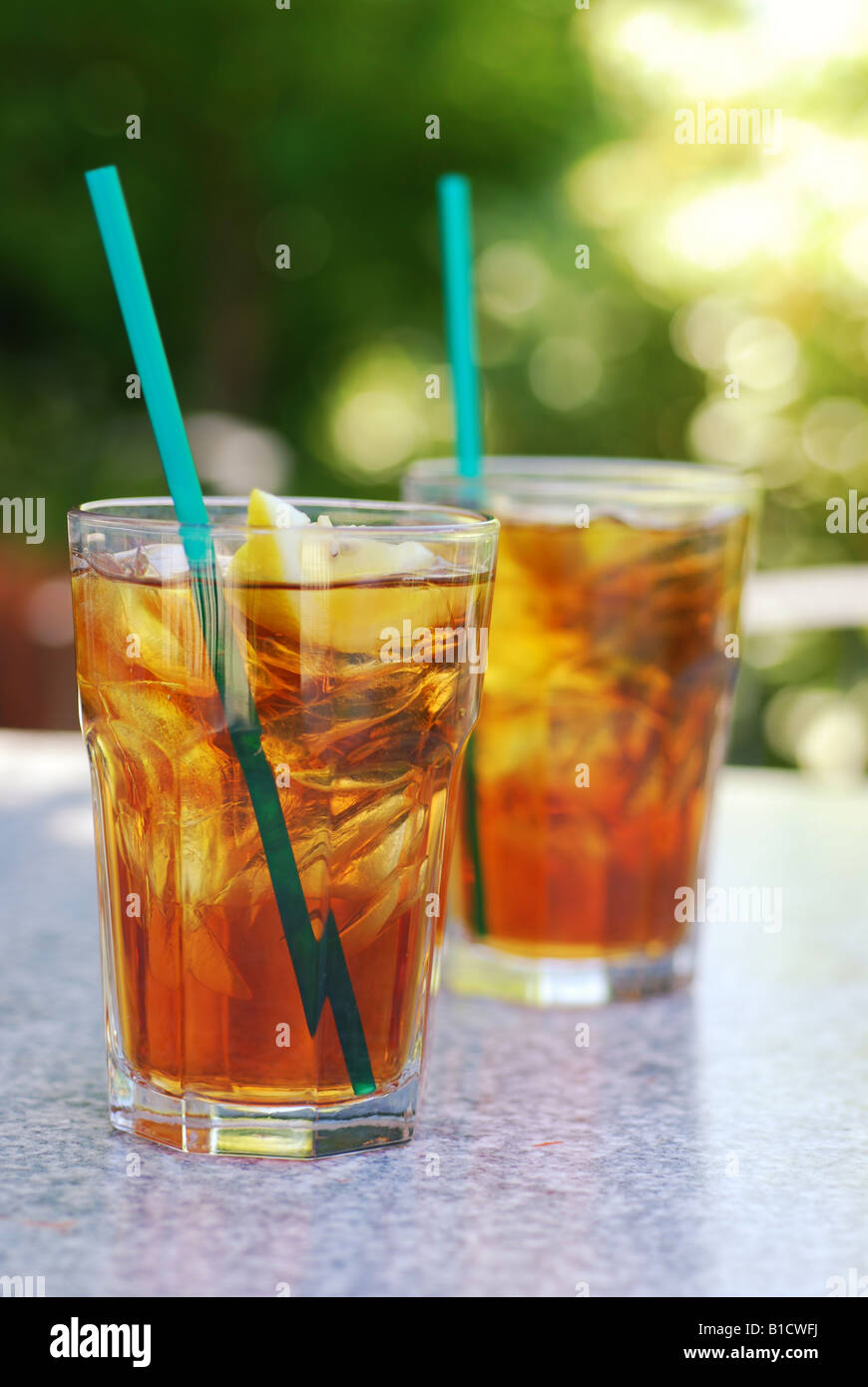 Two glasses of cold iced tea with straws at an outdoor cafe Stock Photo ...