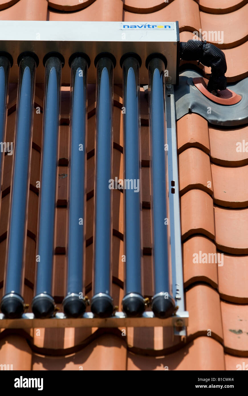 Solar evacuated tubes fitted on the roof of a house in Alderton ...