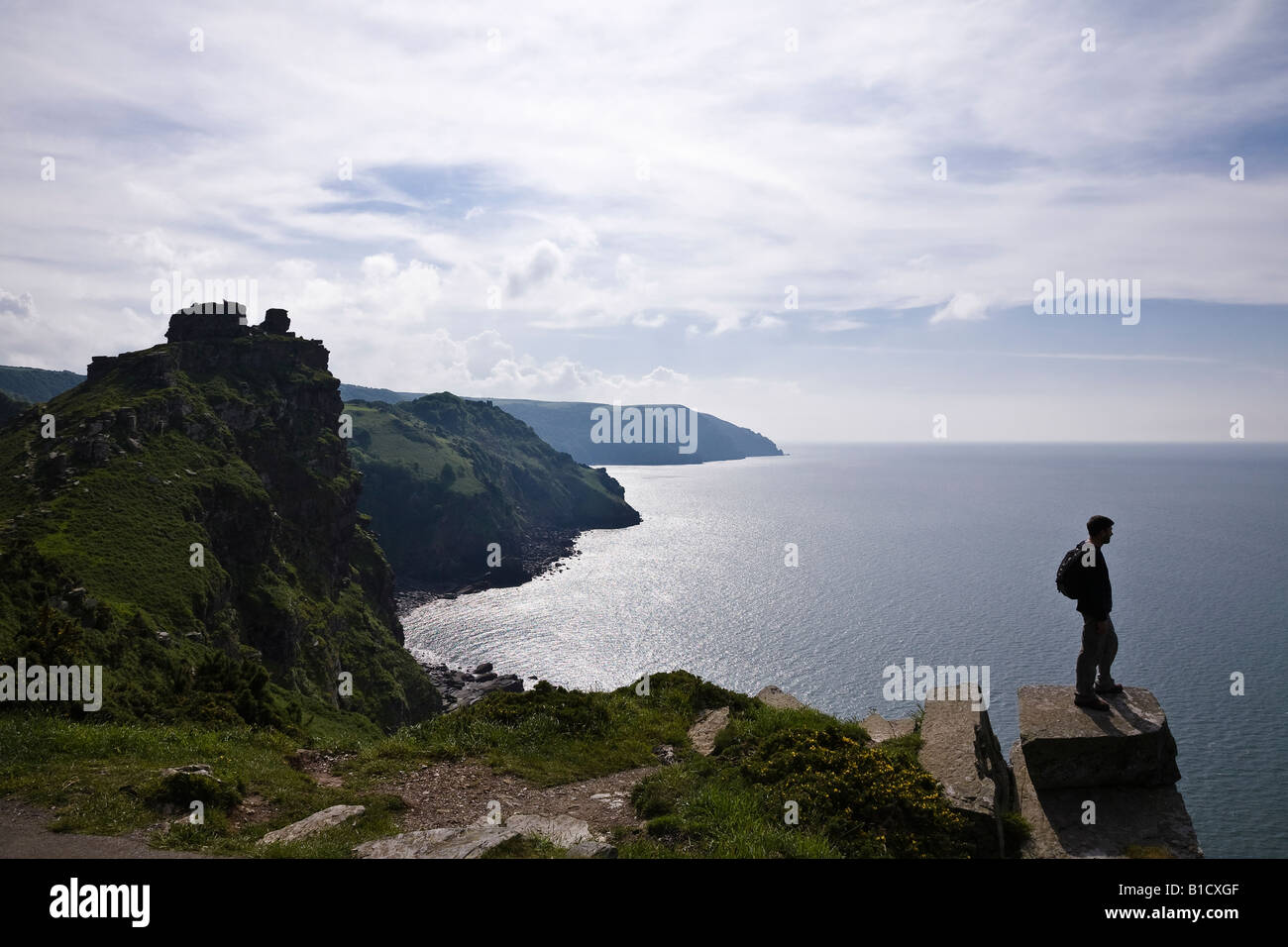 Walker admiring the view from the cliff edge at the Valley of Rocks ...