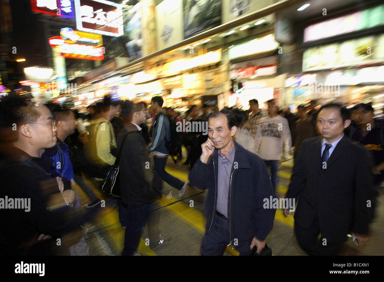 People crossing a street in Kowloon district, Hong Kong, China Stock ...