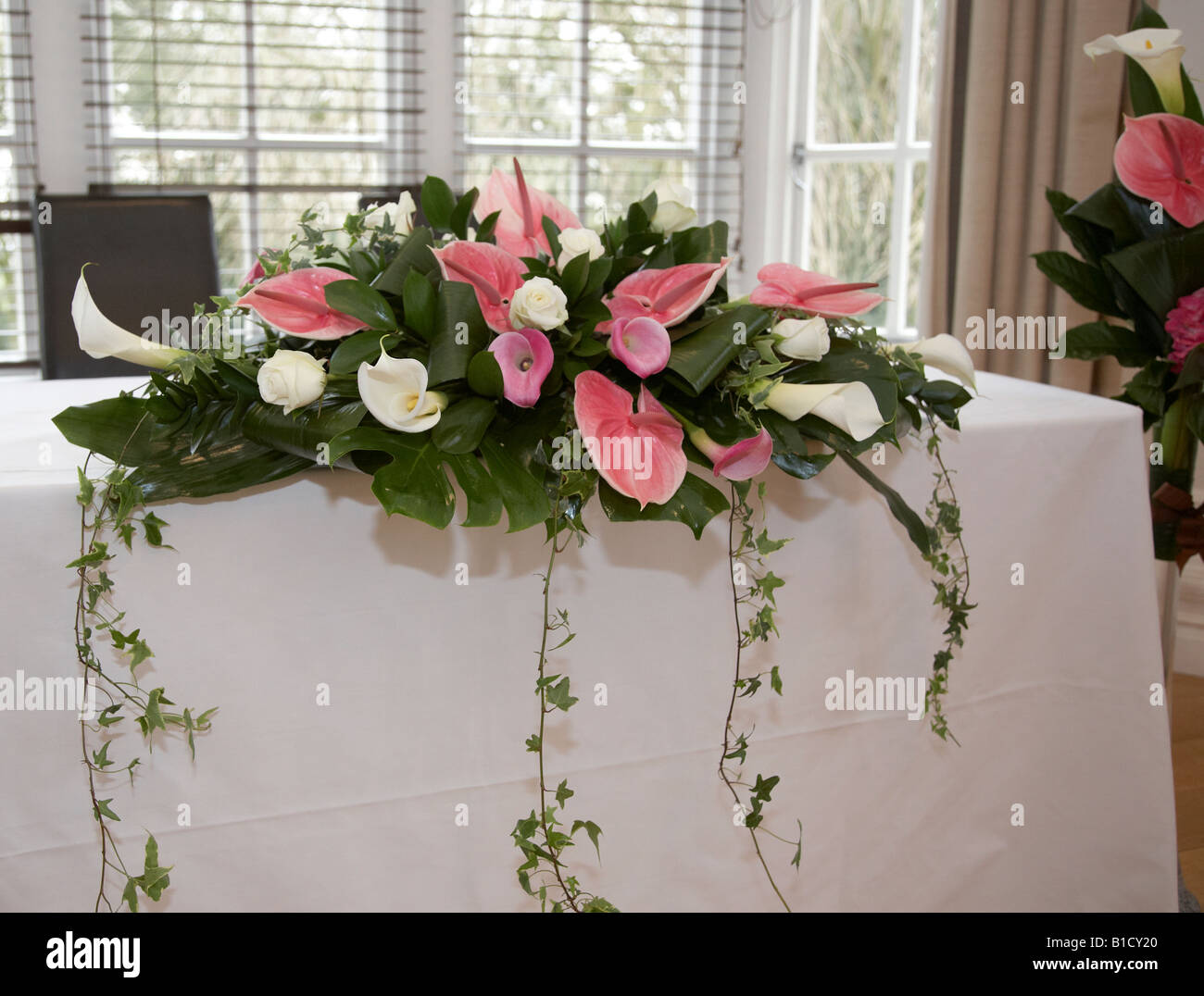 Wedding flowers on the registrars table Stock Photo - Alamy