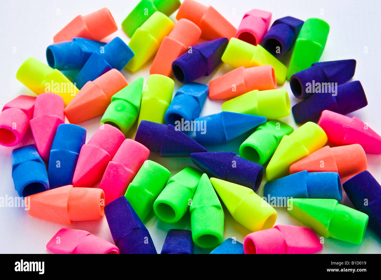 Pile of multi-colored pencil erasers on white background Stock Photo ...