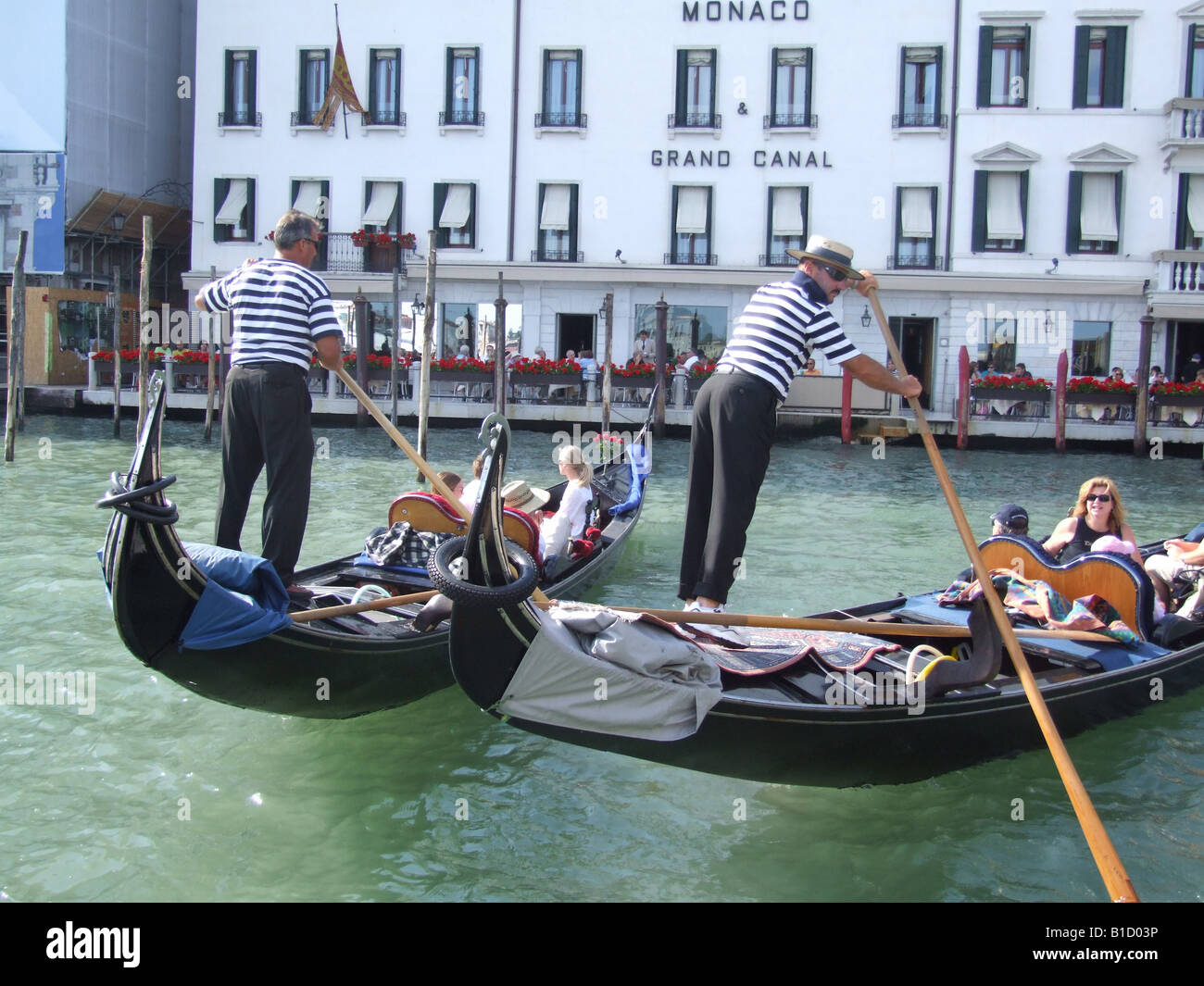 gondoliers on the canal in venice italy Stock Photo - Alamy