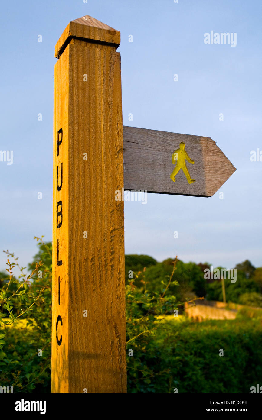 Wooden Public Footpath sign in countryside England UK with blue sky and ...