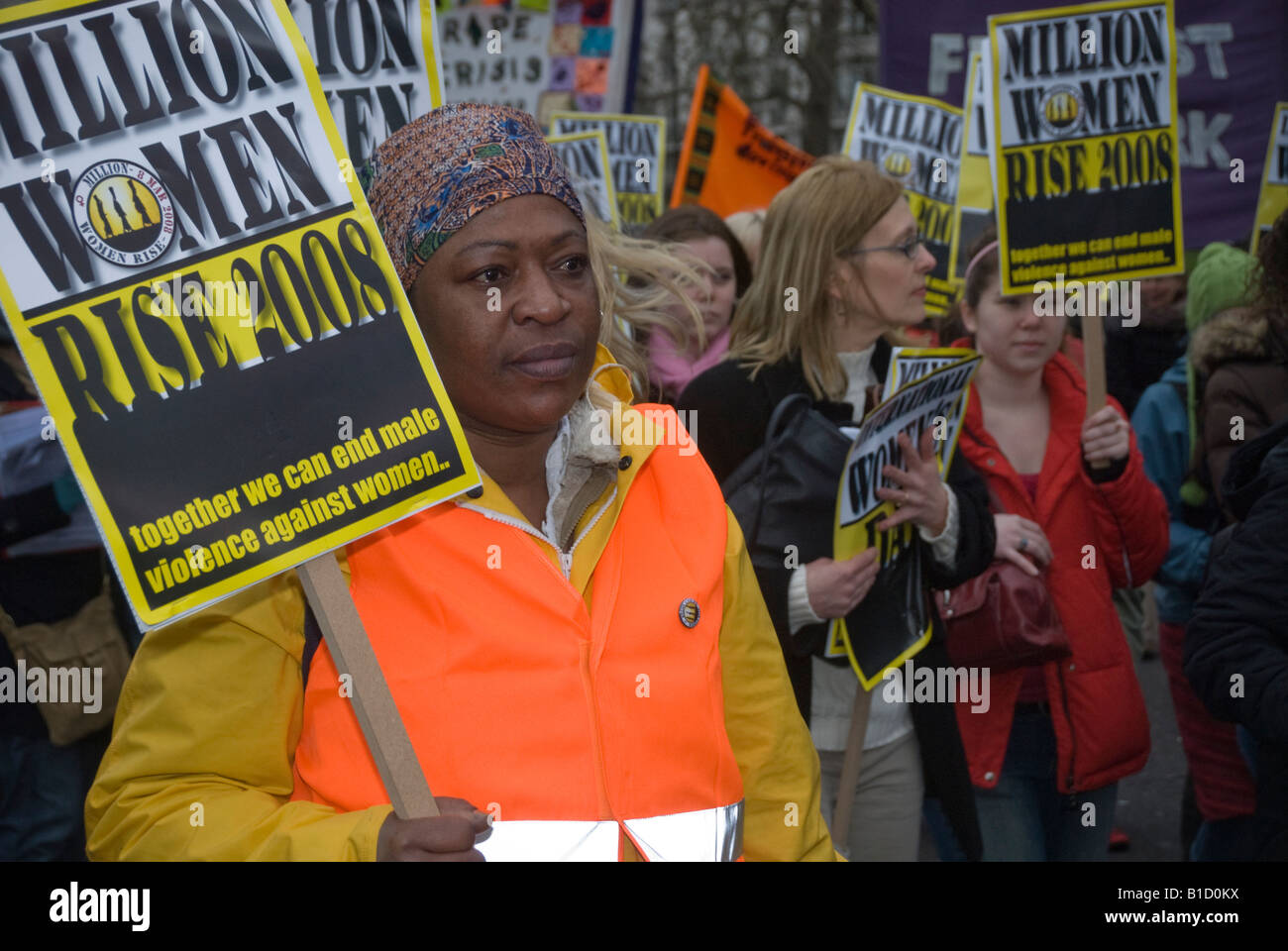 Black and white women in march with 'Million Women Rise 2008' placards ...