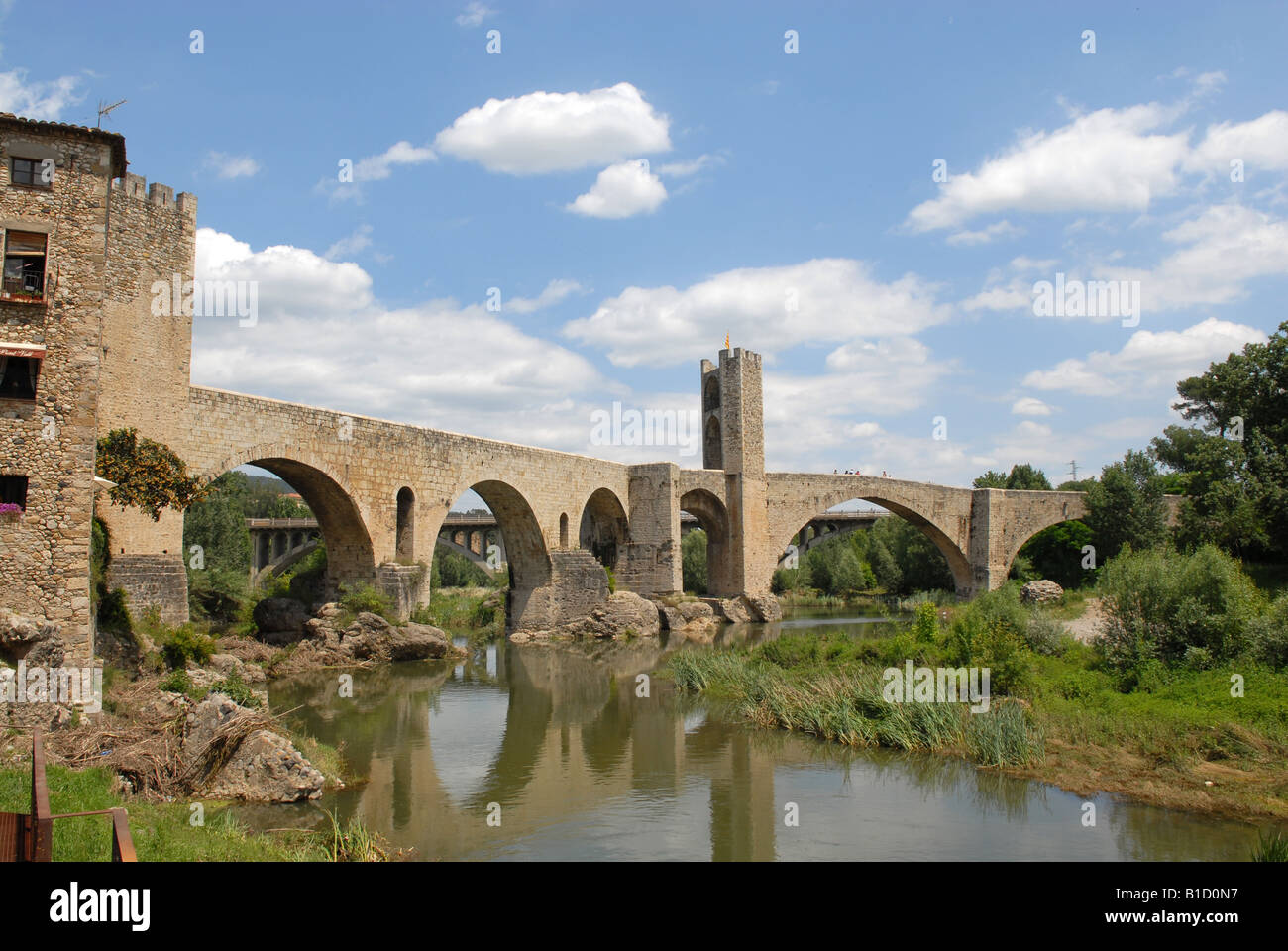 The ancient bridge crossing the River Fluvia at Besalu in Spain Stock ...