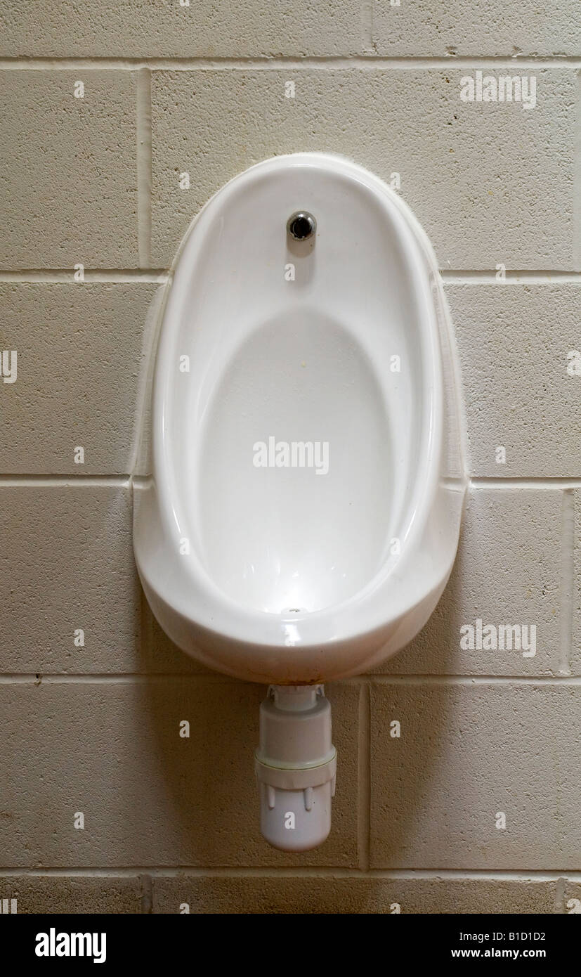 Close up view of urinal in a public toilet Stock Photo - Alamy