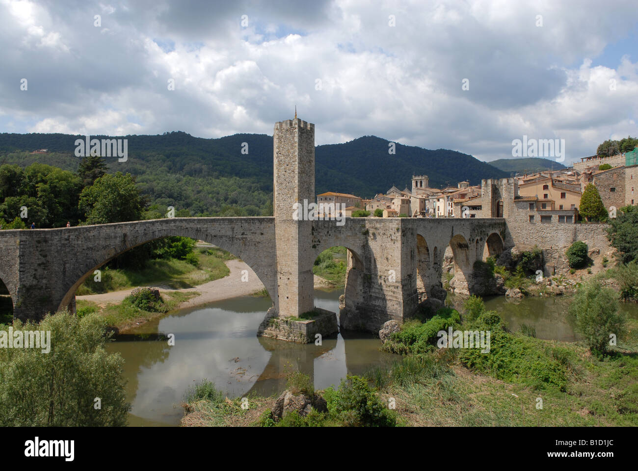 The ancient bridge crossing the River Fluvia at Besalu in Spain Stock ...