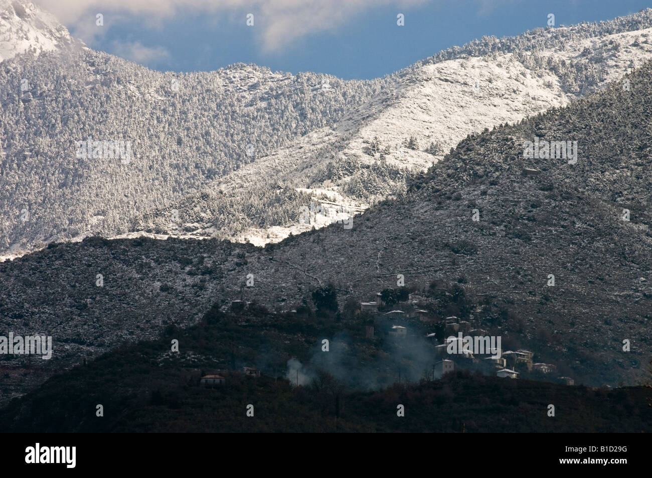 Winter snow covers the village of Saidona in the foothills of the ...