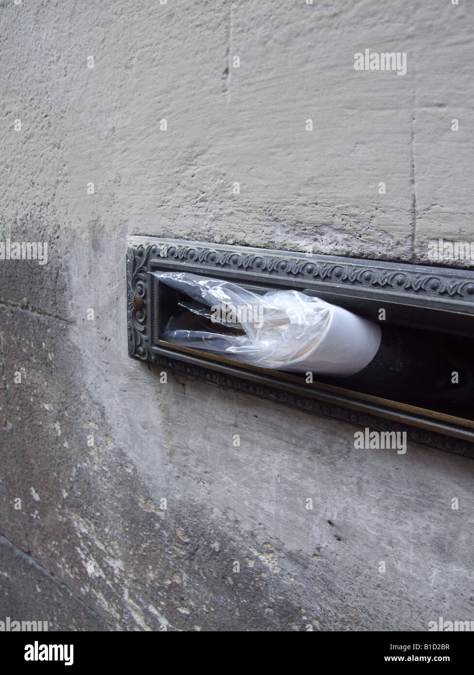 one letter left in house door letterbox slot Stock Photo - Alamy