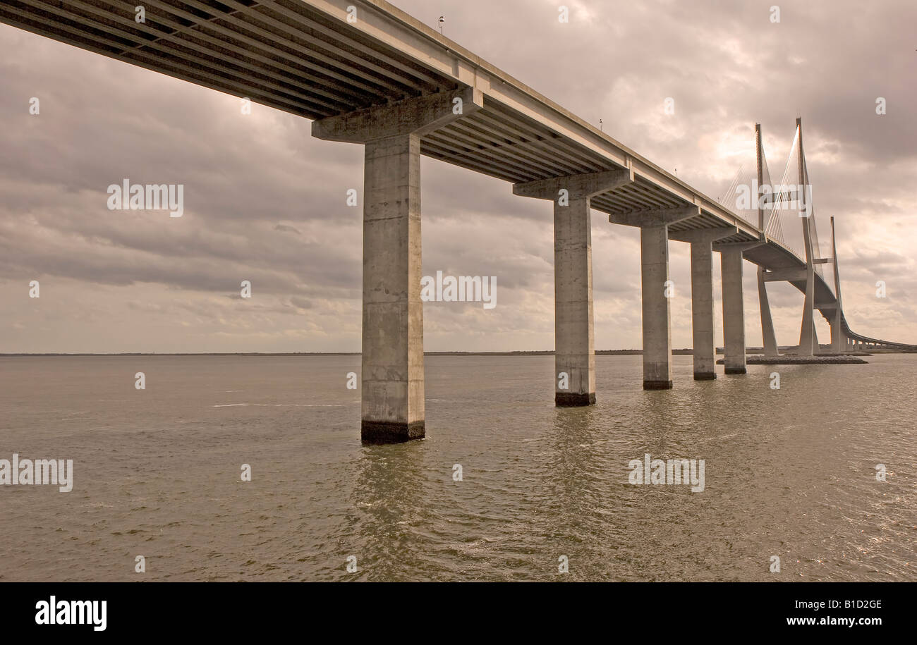 A long span of bridge over the water on a grey winter day Stock Photo ...
