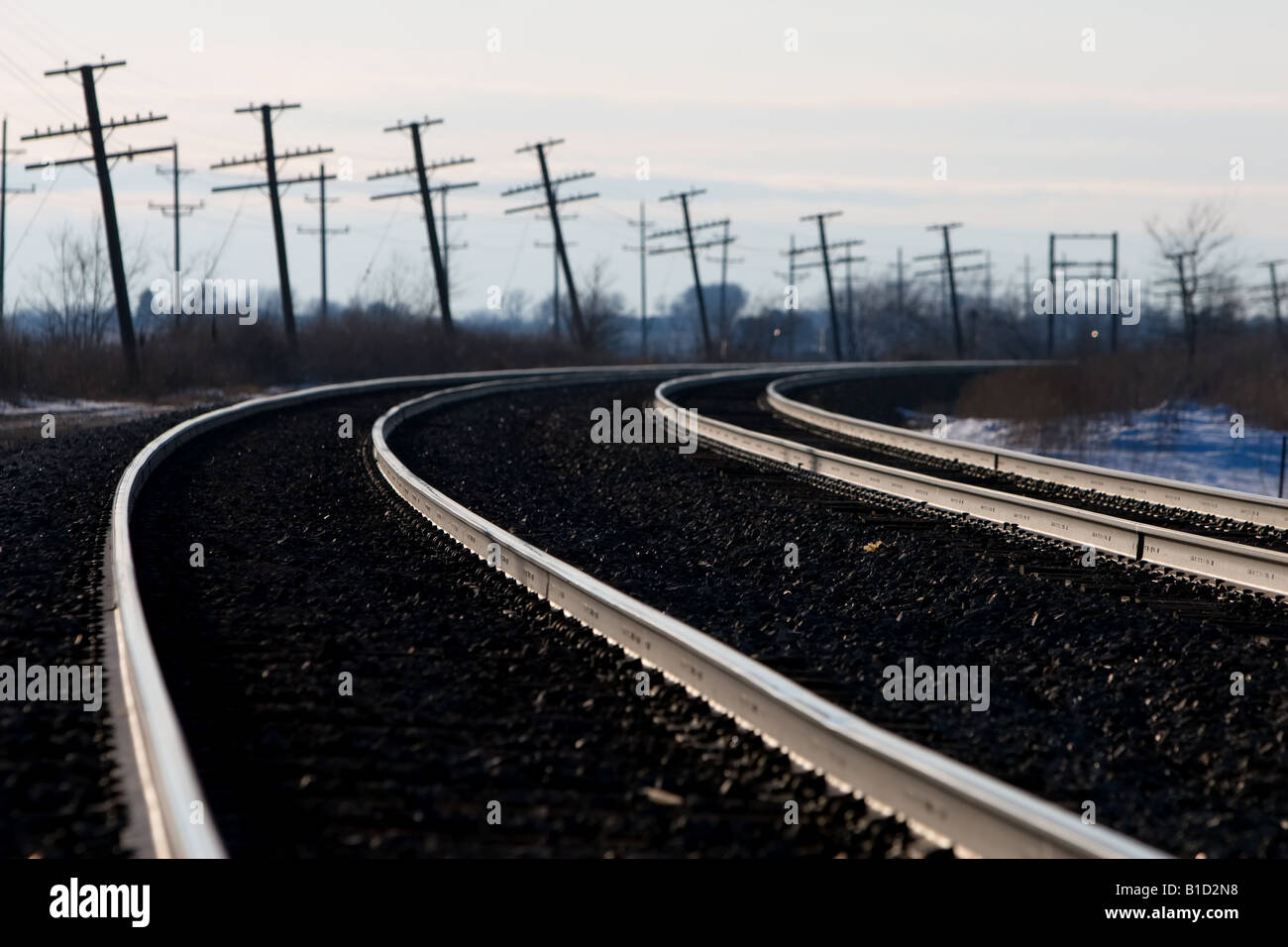 A double track railroad mainline curves towards the horizon Stock Photo ...
