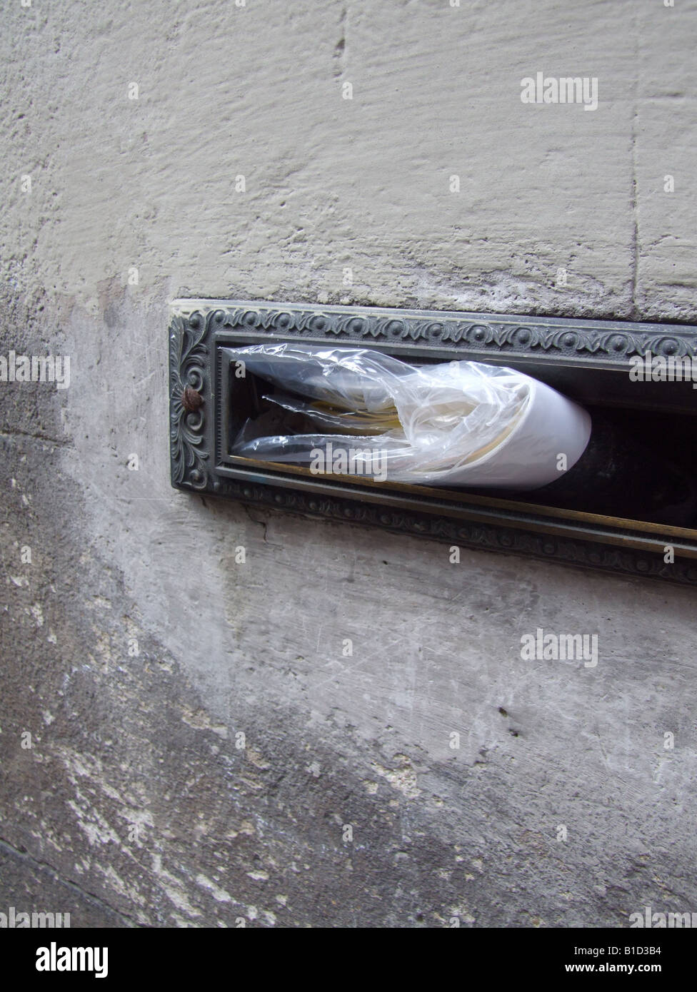 one letter left in house door letterbox slot Stock Photo - Alamy