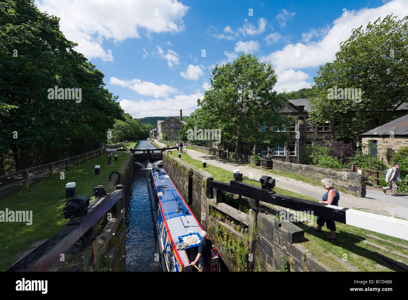 Narrowboat entering the lock gates on the Rochdale Canal, Hebden Bridge ...