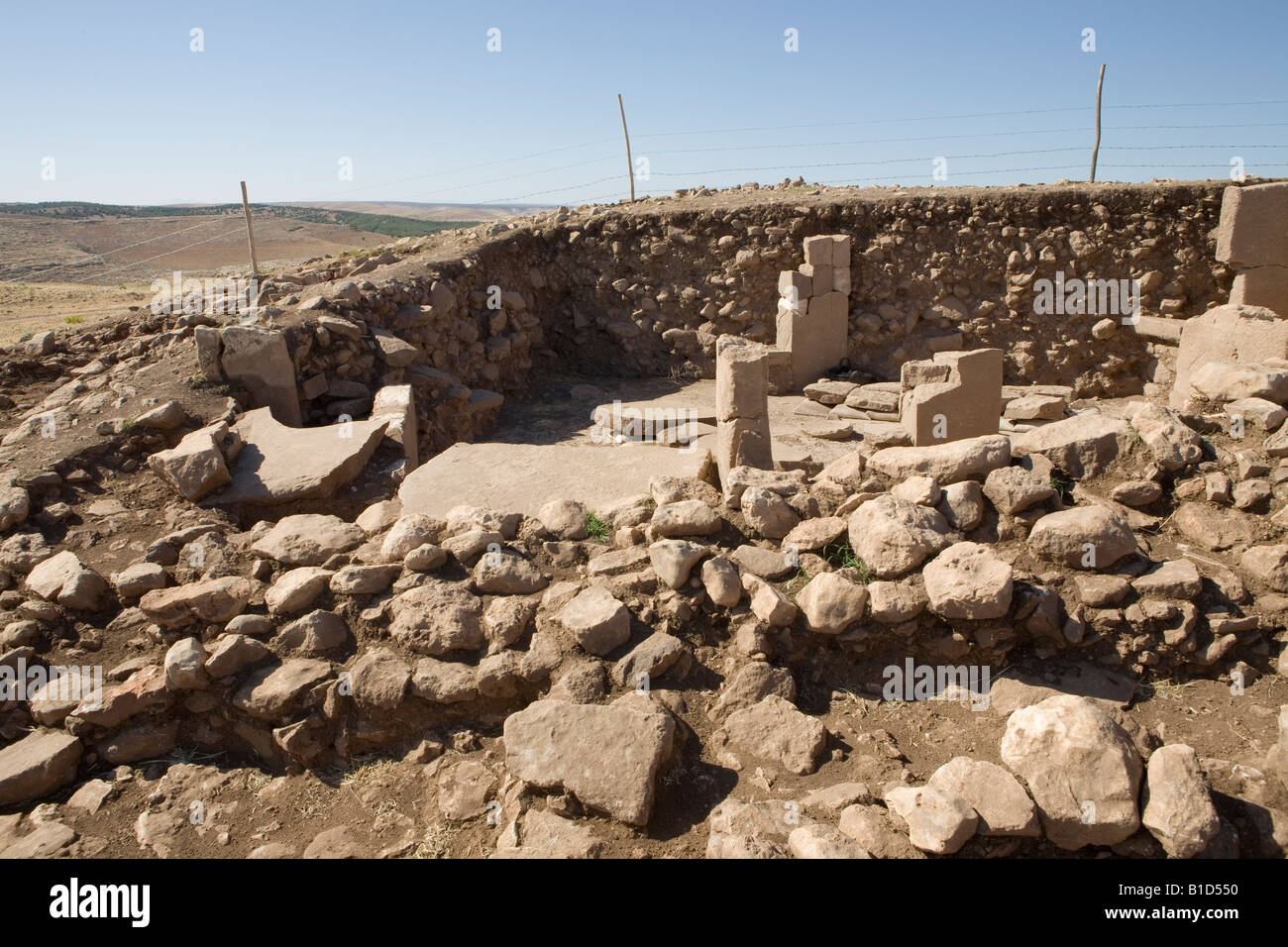Standing stones with in the walls at The Neolithic site of Gobekli Tepe ...