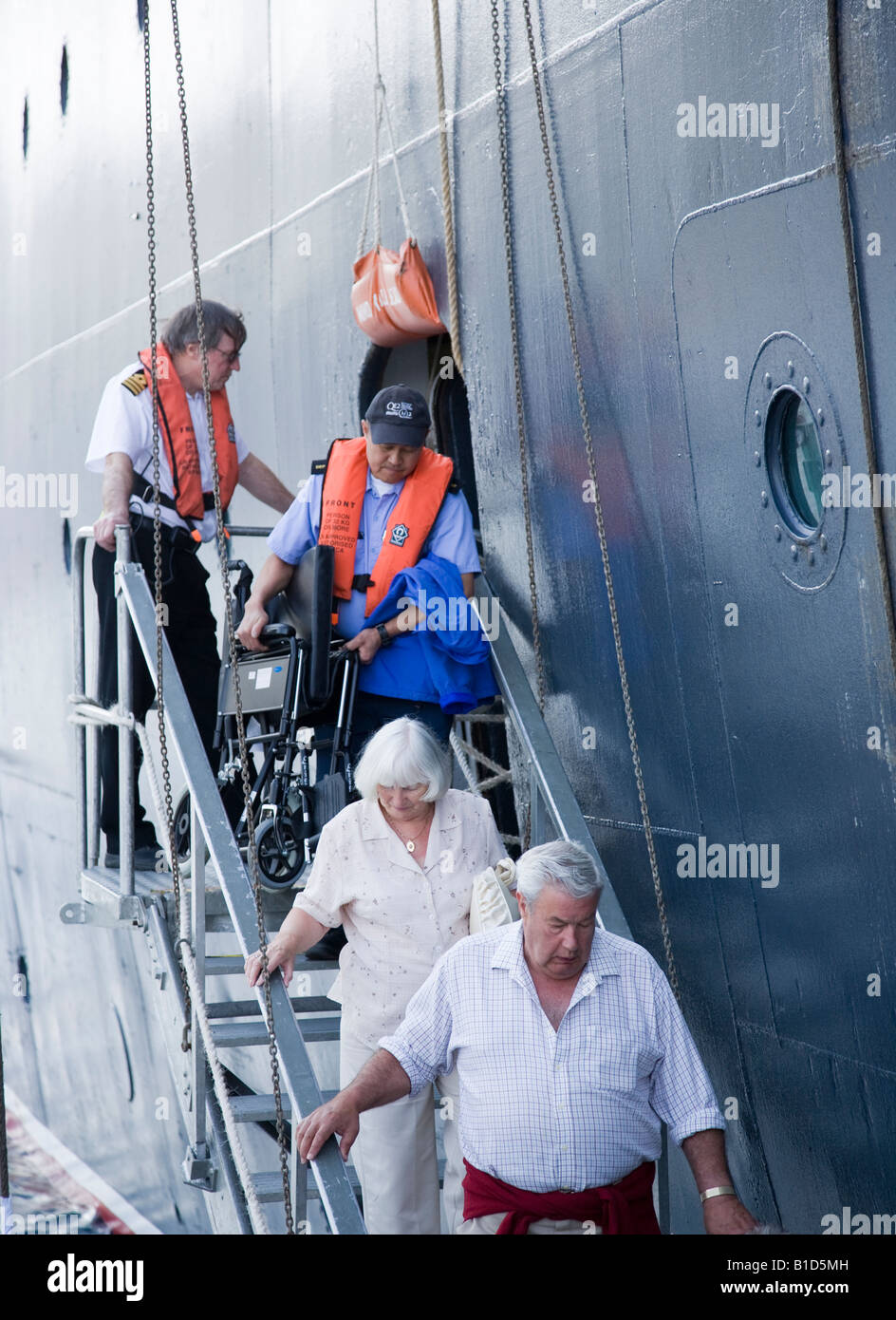 Passenger disembarking from Cunard QE2 whilst anchored onto tenders ...