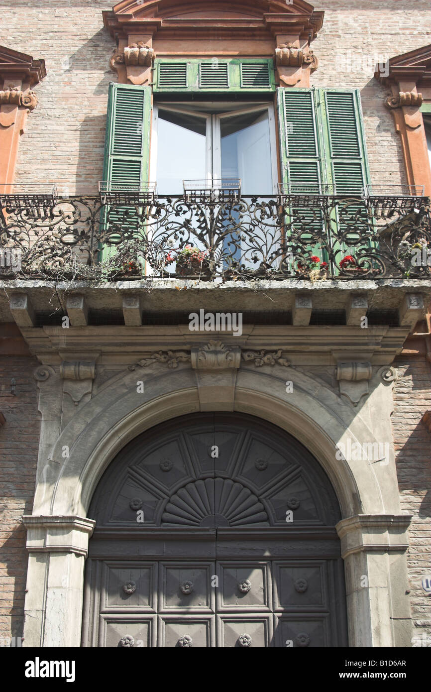 Front of house in Ferrara Italy detailing yellow and orange stonework ...