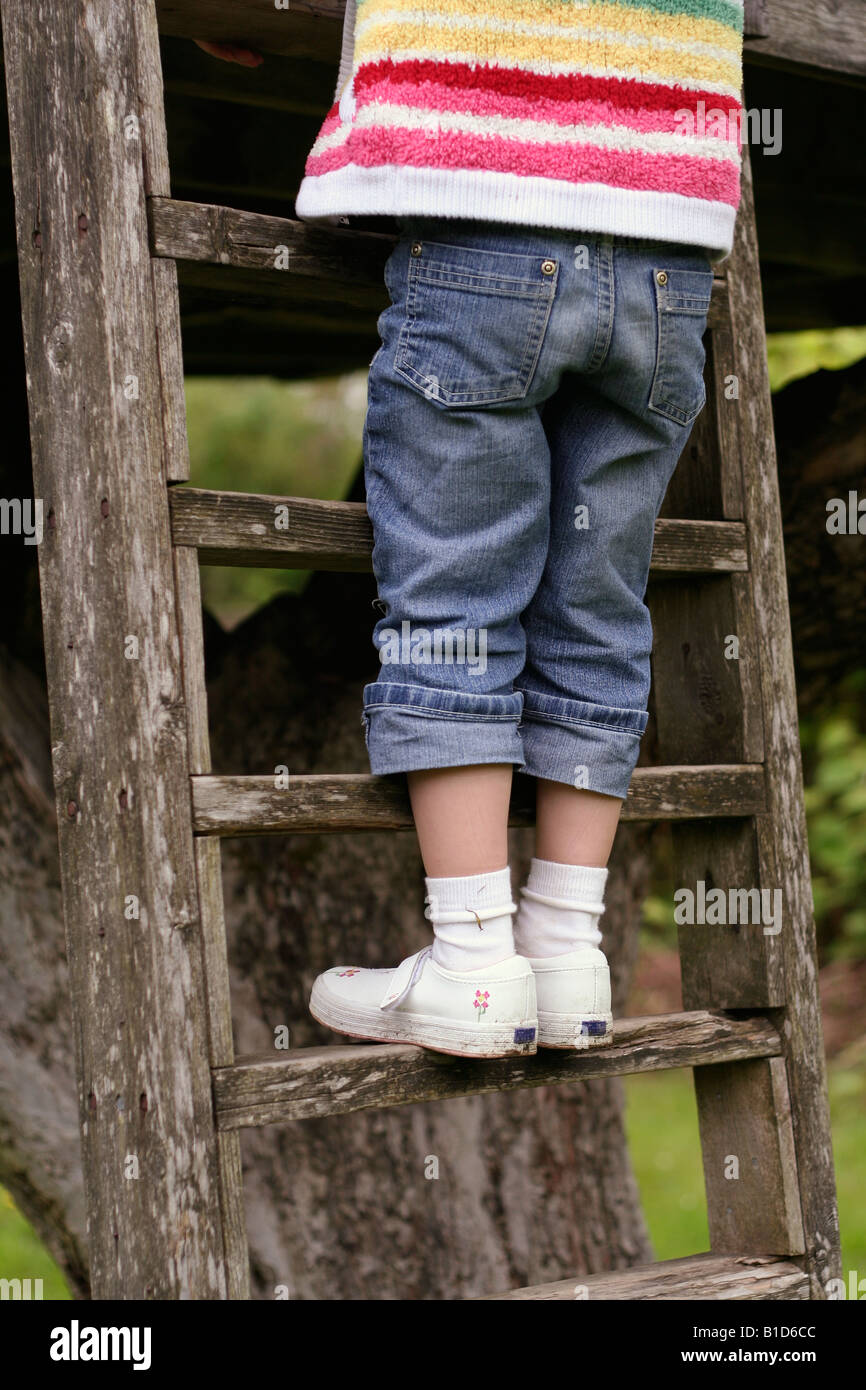 little girl climbing on a tree-house ladder Stock Photo - Alamy
