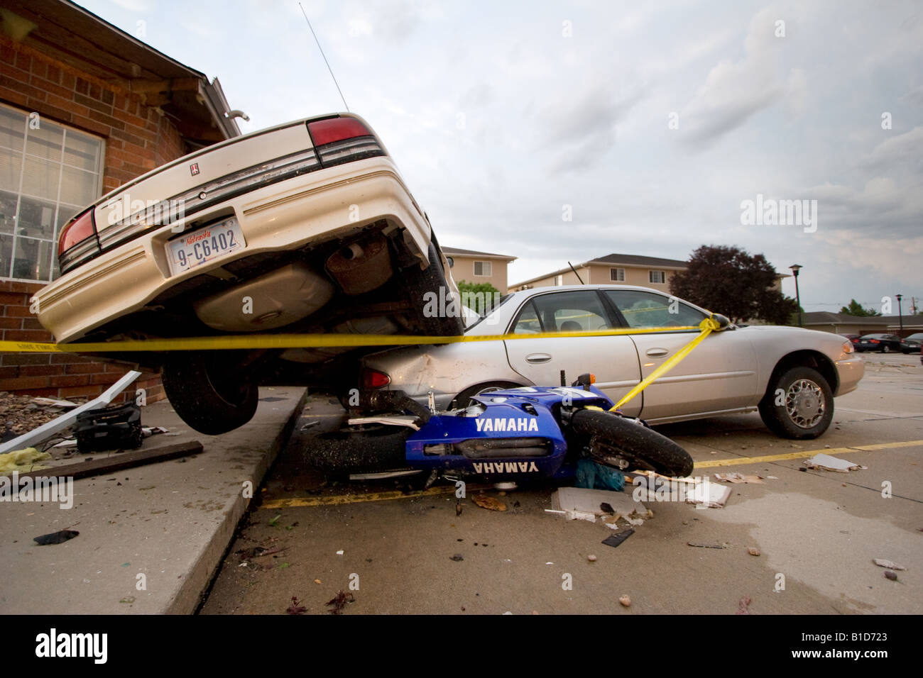 Cars piled atop each other after several tornadoes went through Kearney ...