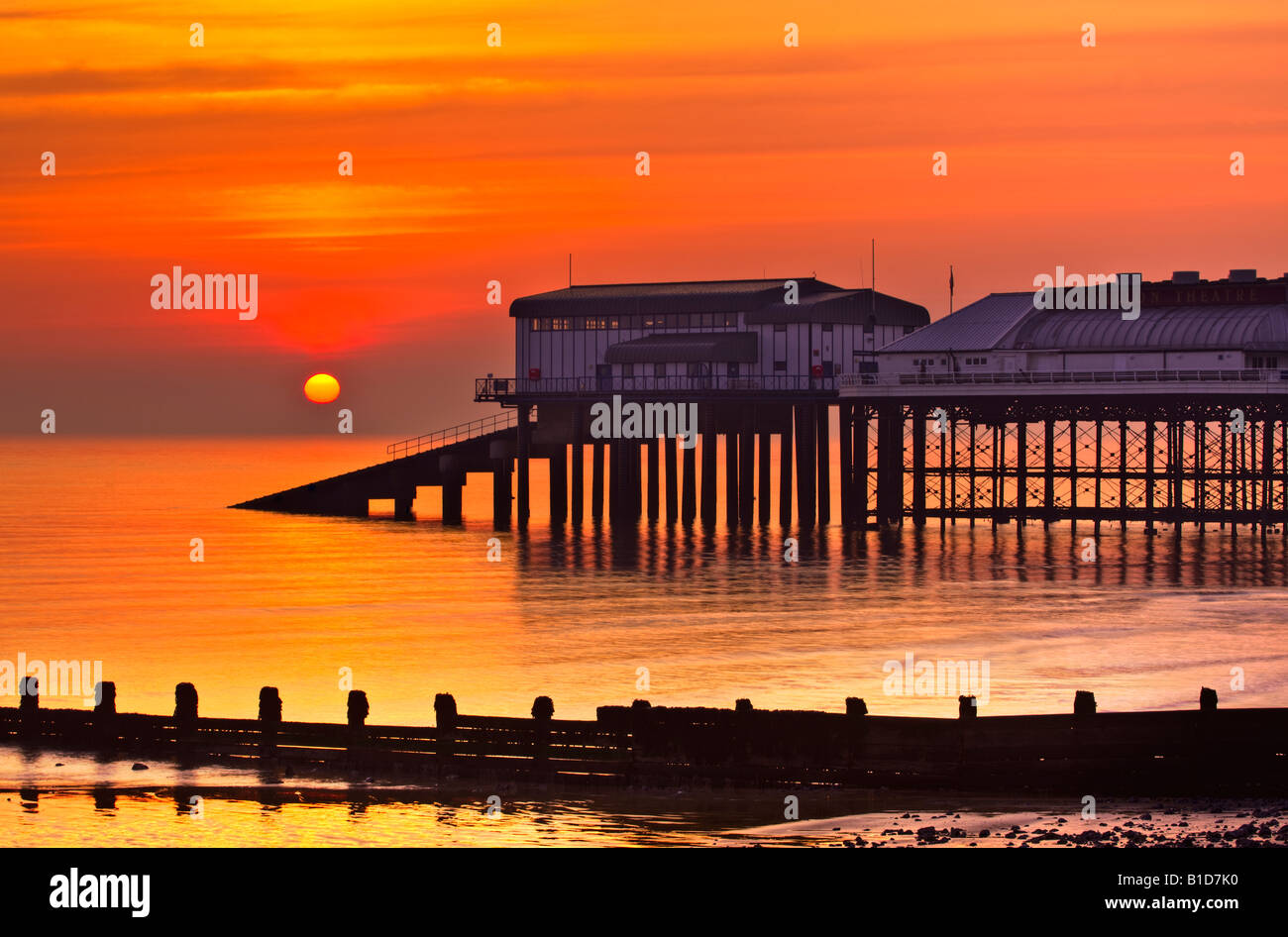 Cromer pier sunrise Stock Photo - Alamy