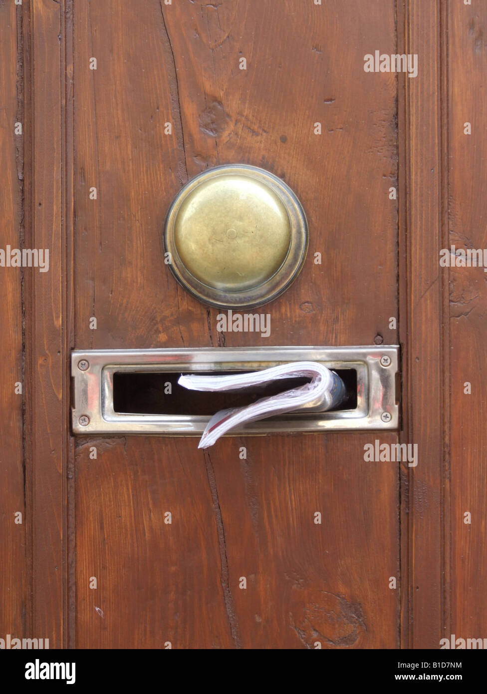 one letter left in house door letterbox slot Stock Photo - Alamy