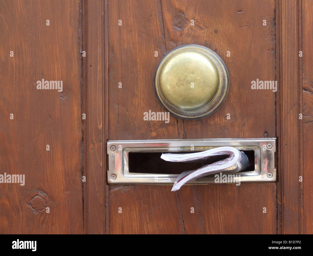 one letter left in house door letterbox slot Stock Photo - Alamy