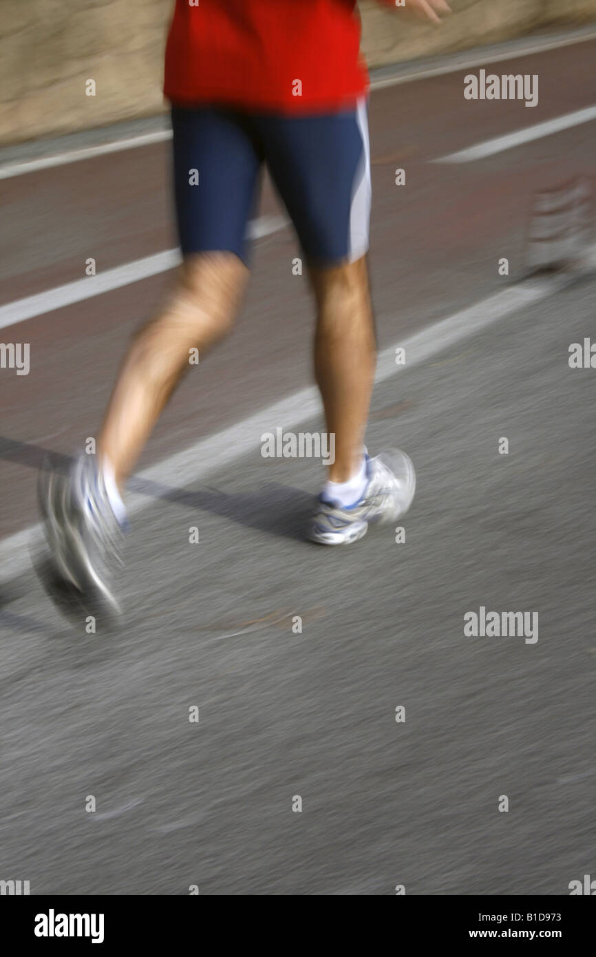 Lonely runner on road hi-res stock photography and images - Alamy