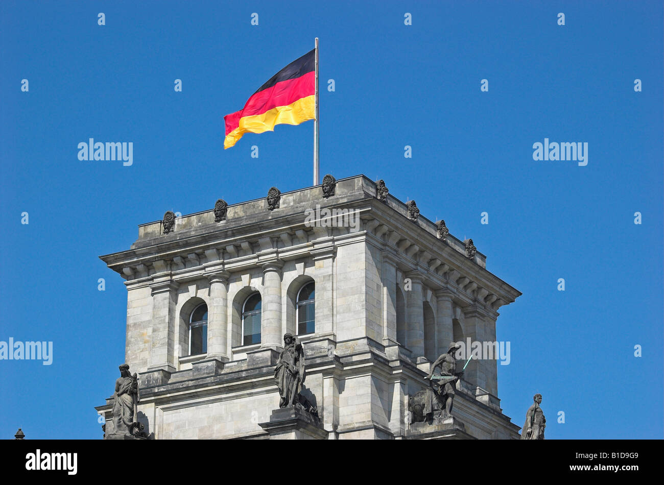 German flag atop parliamentary building Reichstag Berlin Germany April ...