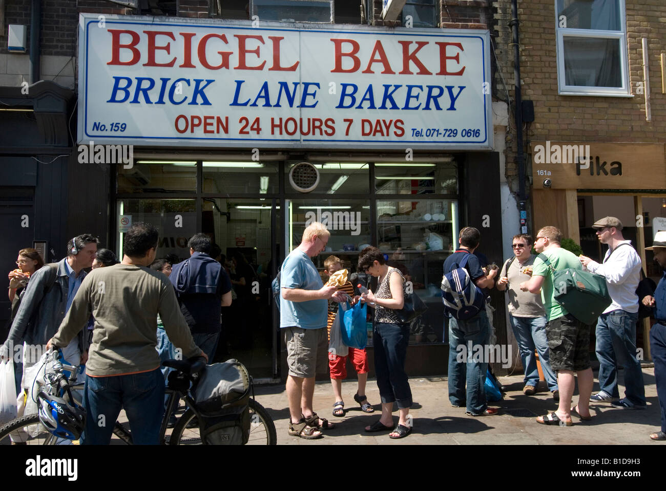Brick Lane Beigel Bake Sunday morning .Customers eat their bagels in ...